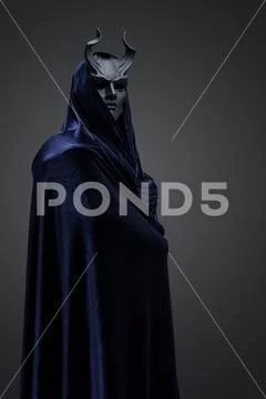 Dark sorcerer of dark cult with dark blue robe Stock Image #233368396
