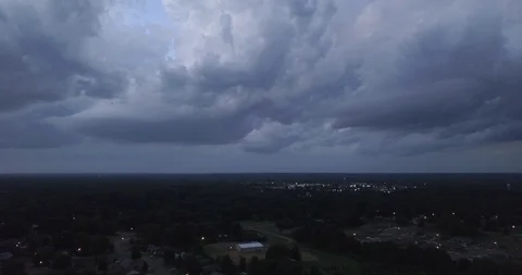 Dark storm clouds rolling in over small ... | Stock Video | Pond5