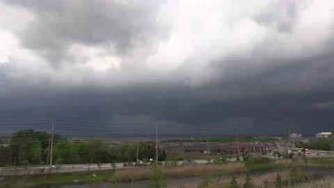 Dark storm clouds rolling in over city r... | Stock Video | Pond5