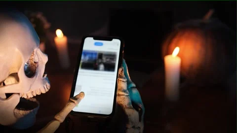 In darkness death, skeleton scrolls thro... | Stock Video | Pond5