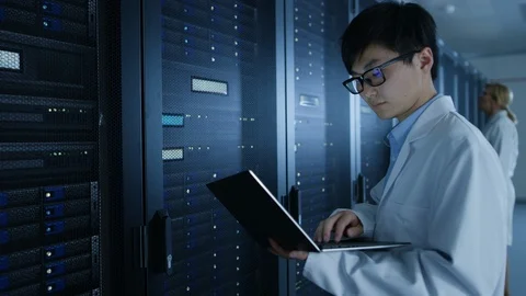 In Data Center: Male and Female IT Speci... | Stock Video | Pond5