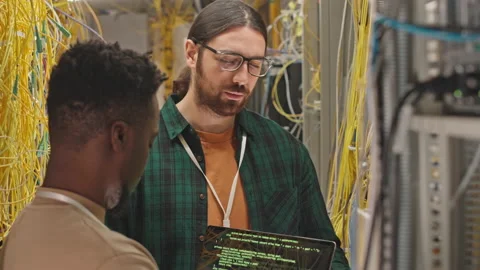 Data Center Workers Coding on Laptop in ... | Stock Video | Pond5