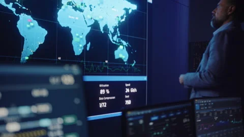 Data Scientist Looks at Global Map Chart... | Stock Video | Pond5