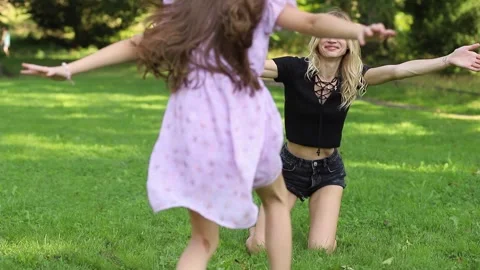 Daughter running to mother for a hug in ... | Stock Video | Pond5