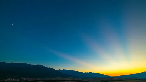 The day to night cycle on the mountain b... | Stock Video | Pond5