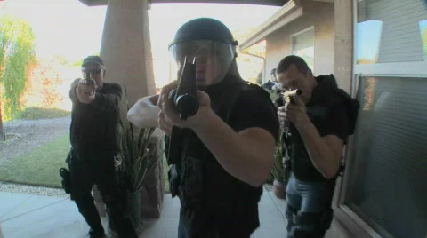 DEA or SWAT officers with arms drawn per... | Stock Video | Pond5