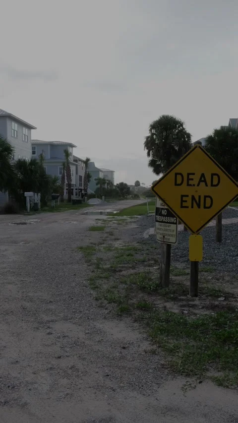 Dead end sign at the beginning of gravel... | Stock Video | Pond5