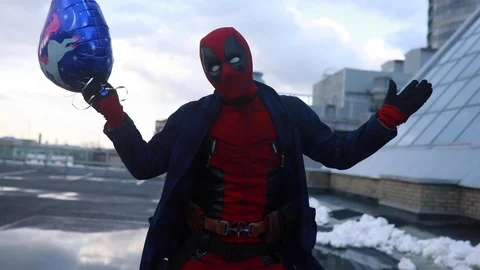 Deadpool cosplayer is having a fun with ... | Stock Video | Pond5