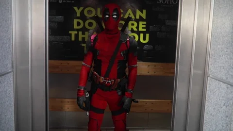 Deadpool cosplayer posing on background ... | Stock Video | Pond5