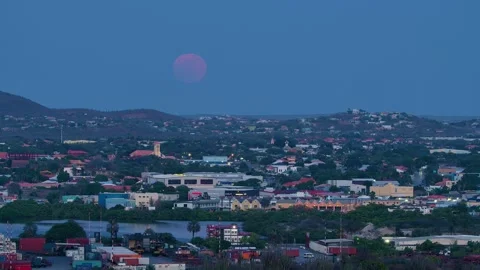 Deep blood red full blue supermoon rises... | Stock Video | Pond5