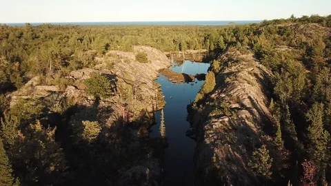 deep blue pond in granite | Stock Video | Pond5