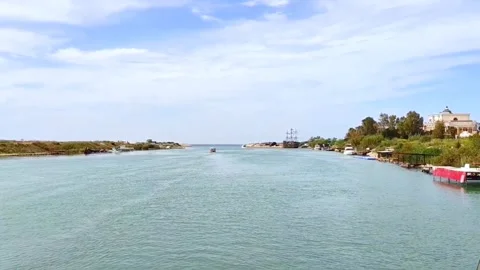 A deep calm river with green banks and ... | Stock Video | Pond5