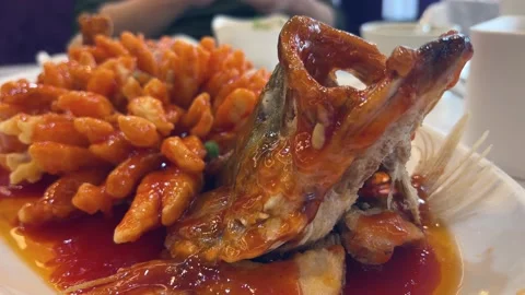 deep fried fish,squirrel mandarin fish | Stock Video | Pond5