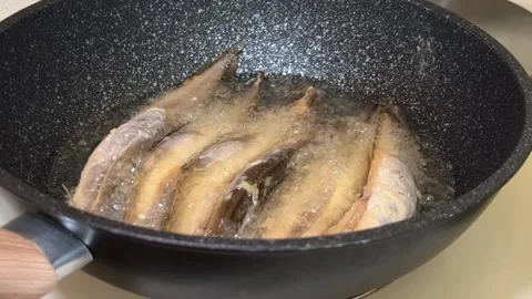 Deep Fried Peacock Eel or Spotfin Spiny ... | Stock Video | Pond5