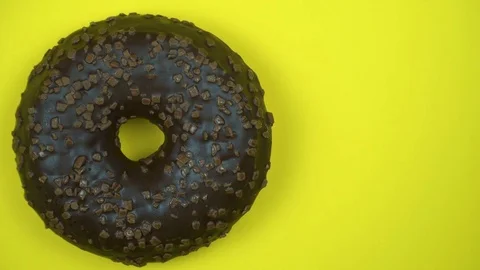 Delicious sweet donut rotating on a plat... | Stock Video | Pond5
