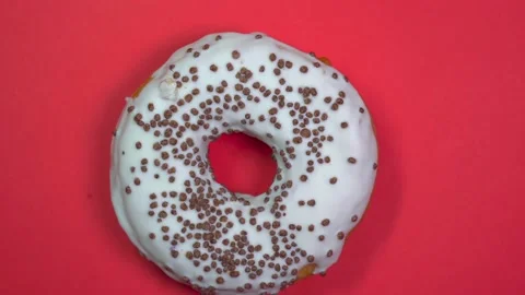 Delicious sweet donut rotating on a plat... | Stock Video | Pond5