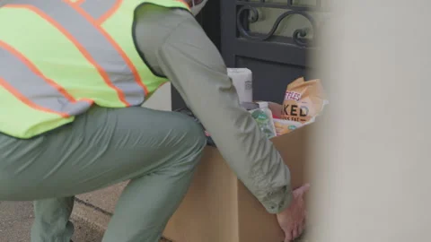 Delivery Guy Drops Grocery Box Off On Po... | Stock Video | Pond5