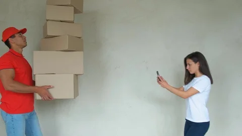 Delivery Man With Falling Stack Of Boxes... | Stock Video | Pond5
