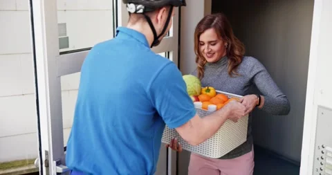 Delivery Man Giving Grocery Plastic Box | Stock Video | Pond5