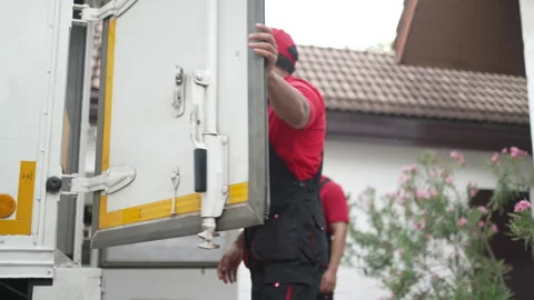 Delivery man move items to the house. | Stock Video | Pond5