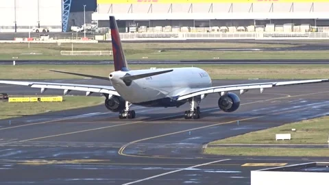Delta Airlines Aircraft Taxiing with bac... | Stock Video | Pond5
