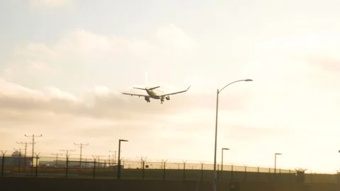 A Delta plane landing at LAX at sunset, ... | Stock Video | Pond5