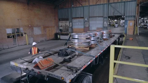Delvering heavy steel coils on flatbed t... | Stock Video | Pond5