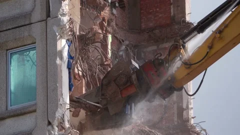 A demolition crane with water cannon | Stock Video | Pond5