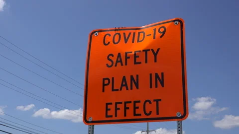 A dented COVID safety sign seen from a l... | Stock Video | Pond5