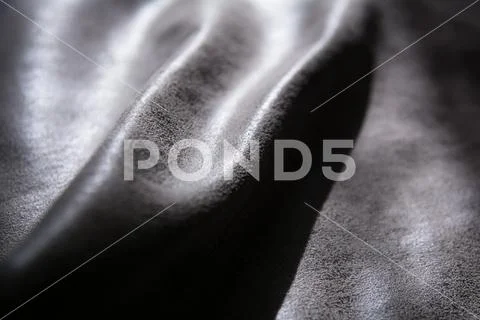 Dented fabric with texture highlighted by light ~ Hi Res #87778208