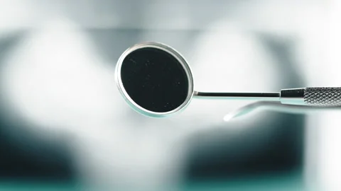 Dentist mirror tool on x-ray background | Stock Video | Pond5