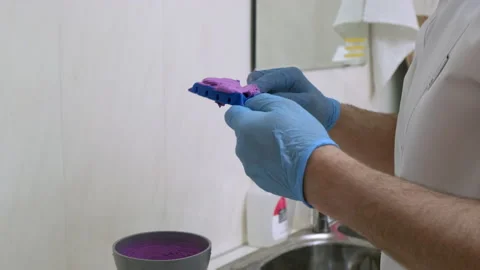 Dentist mix alginate for dental impressi... | Stock Video | Pond5