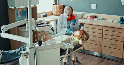 Dentist, woman and chair for teeth consu... | Stock Video | Pond5