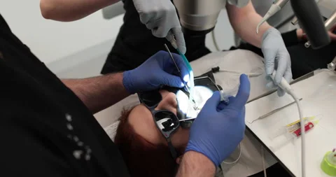 Dentist's hands at work. Oral cavity in ... | Stock Video | Pond5