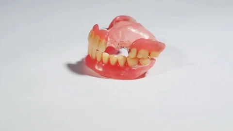 Dentures, removable false teeth made of ... | Stock Video | Pond5