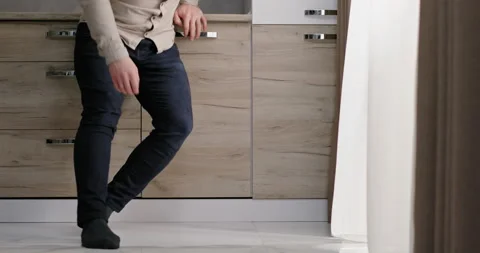 Depressed man falling on floor in kitche... | Stock Video | Pond5