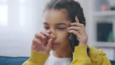 Depressed teen girl crying while talking... | Stock Video | Pond5