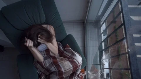Depressed woman crying by the window | Stock Video | Pond5