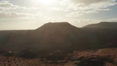 Desert volcano with blowing sand and dus... | Stock Video | Pond5