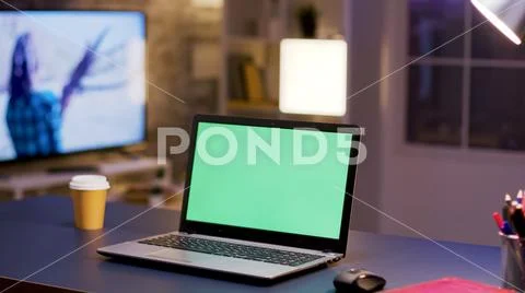 Desktop computer with green screen on home office. Stock Photo #120728245