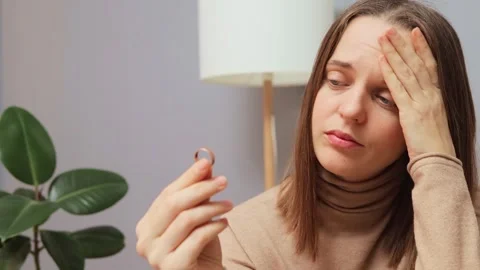 Despair sad unhappy woman holding her we... | Stock Video | Pond5