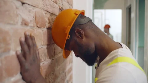 Despaired builder beating head against b... | Stock Video | Pond5