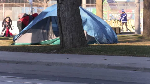 Desperate homeless people sleep in park ... | Stock Video | Pond5