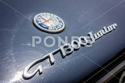 Detail of the Alfa Romeo emblem and the GT 1300 Junior model on the ...