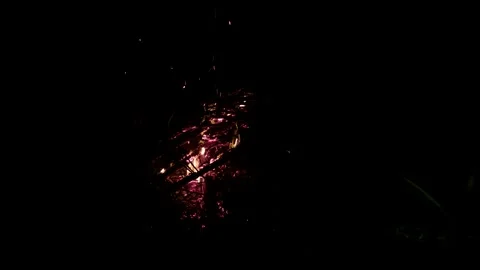 Detail of bonfire sparks isolated on bla... | Stock Video | Pond5