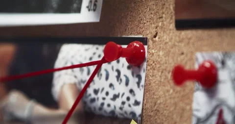 Detail on red pin. Detective's hand wrap... | Stock Video | Pond5