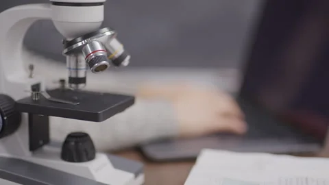 Detail Shot of a Microscope with Hands T... | Stock Video | Pond5