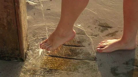 Detail on young female feet showering un... | Stock Video | Pond5