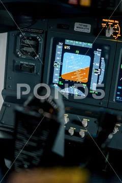 A detailed shot of the control and navigation panel in the cockpit of a ...