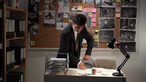 Detective processing evidence working in... | Stock Video | Pond5